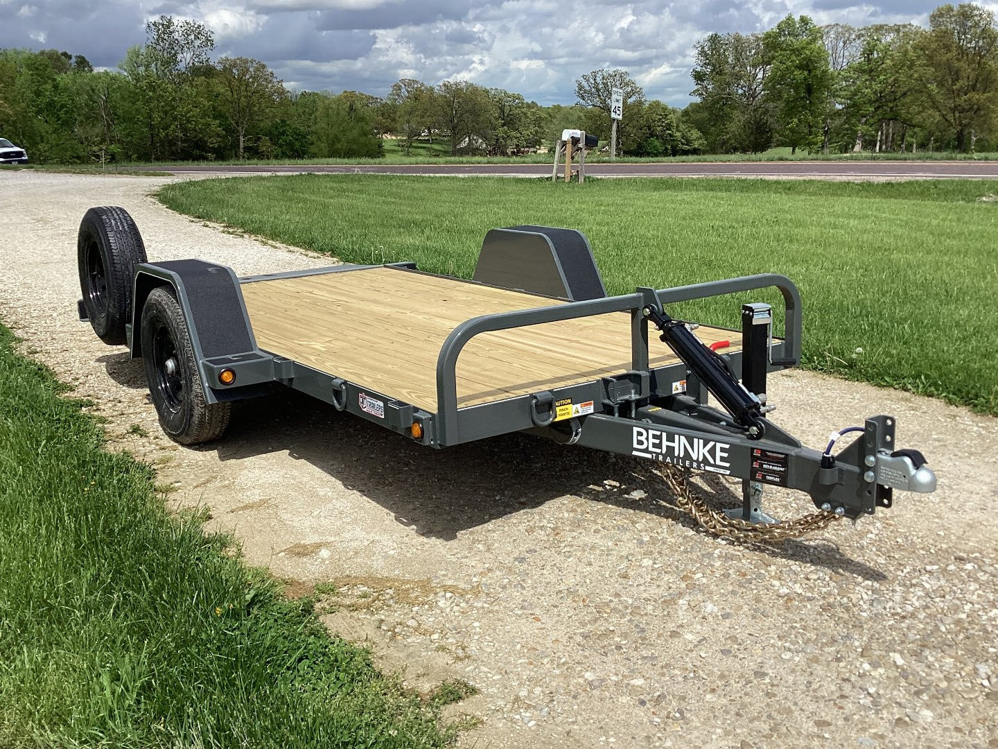 New 2025 Behnke 72x14 Single Axle Gravity Tilt Utility Trailer, 7k
