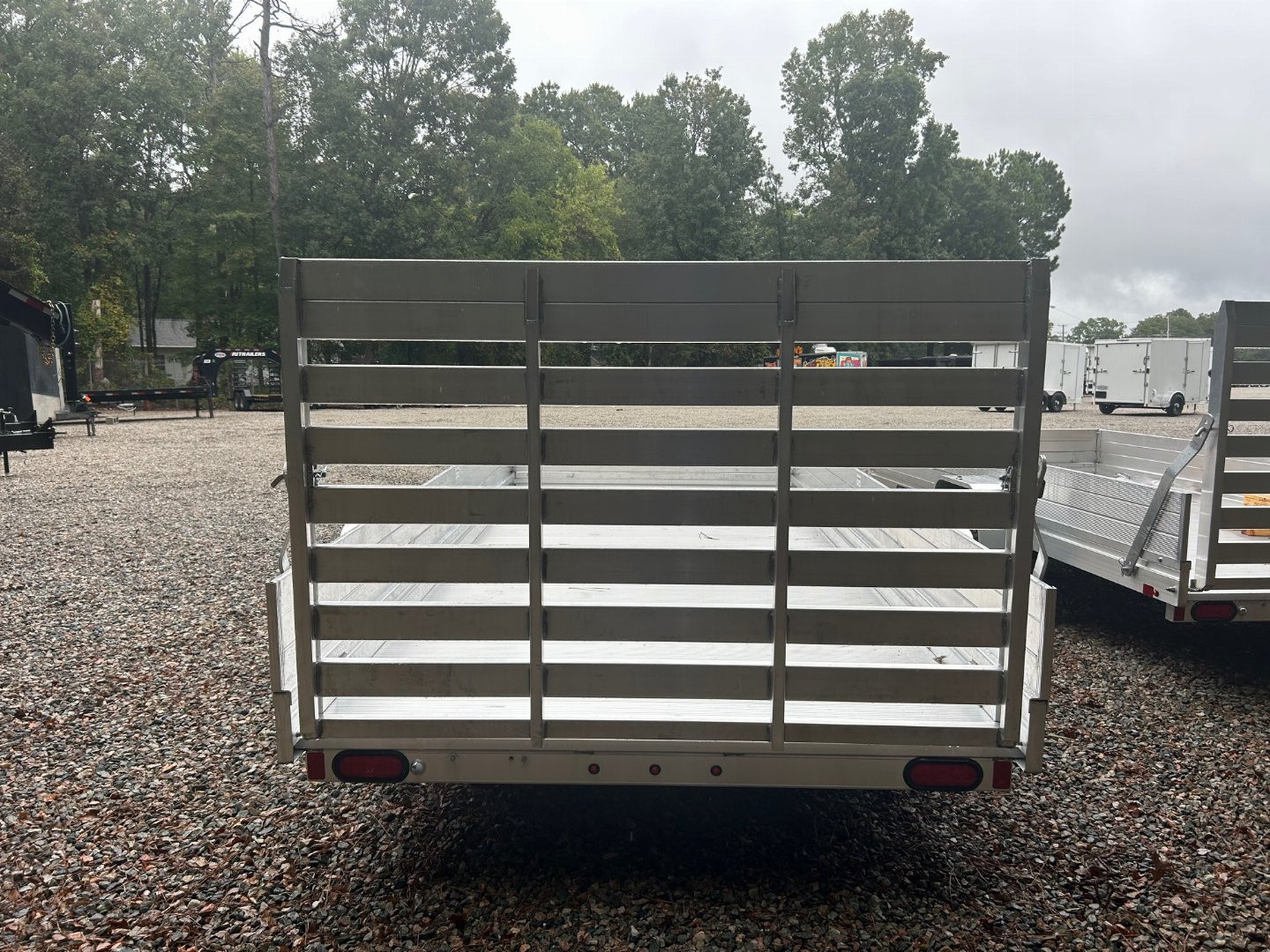 New 2025 ALUMA 6812H w/ 12" Solid Sides & Gate Utility Trailer