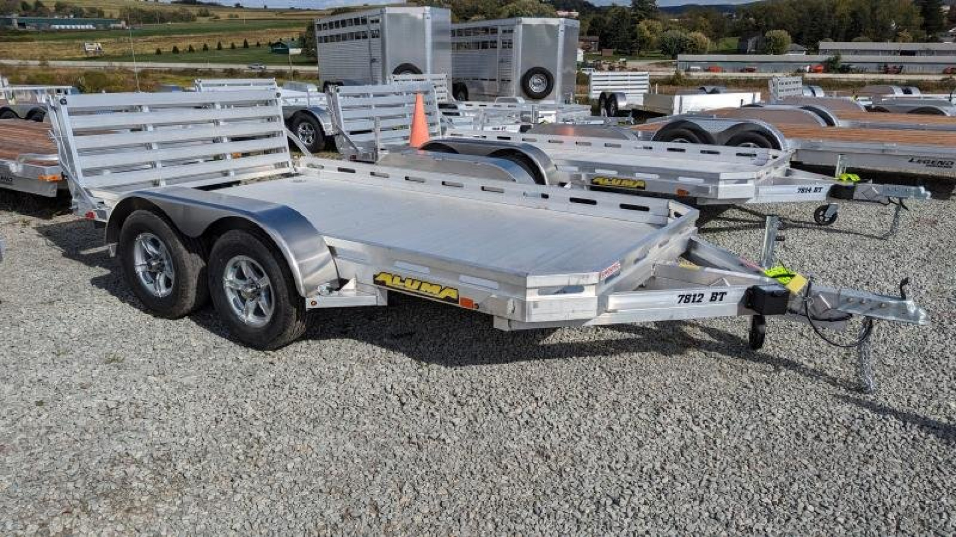 New 2025 Aluma 6'6" x 12' Tandem Axle Utility Trailer w/ Bi-Fold Gate