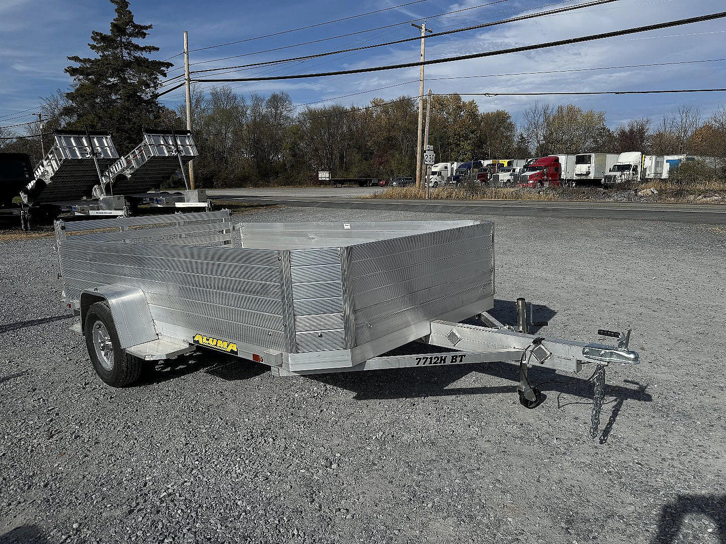 New 2025 ALUMA 7712H 2 FT Solid Sides Bifold Gate Utility Trailer