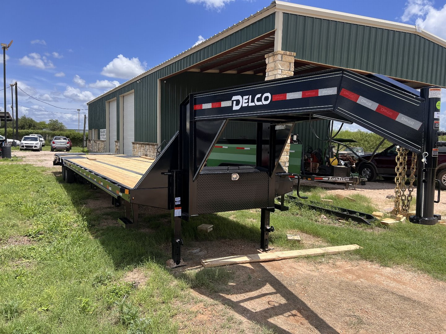 New 2024 DELCO TRAILERS 102x40ft 25k Flatbed Trailer