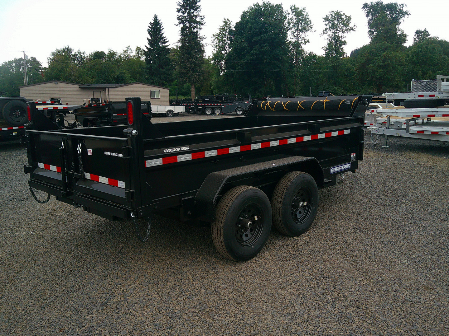 New 2025 Sure-Trac 6x10 SD Low Profile 10K Dump Trailer