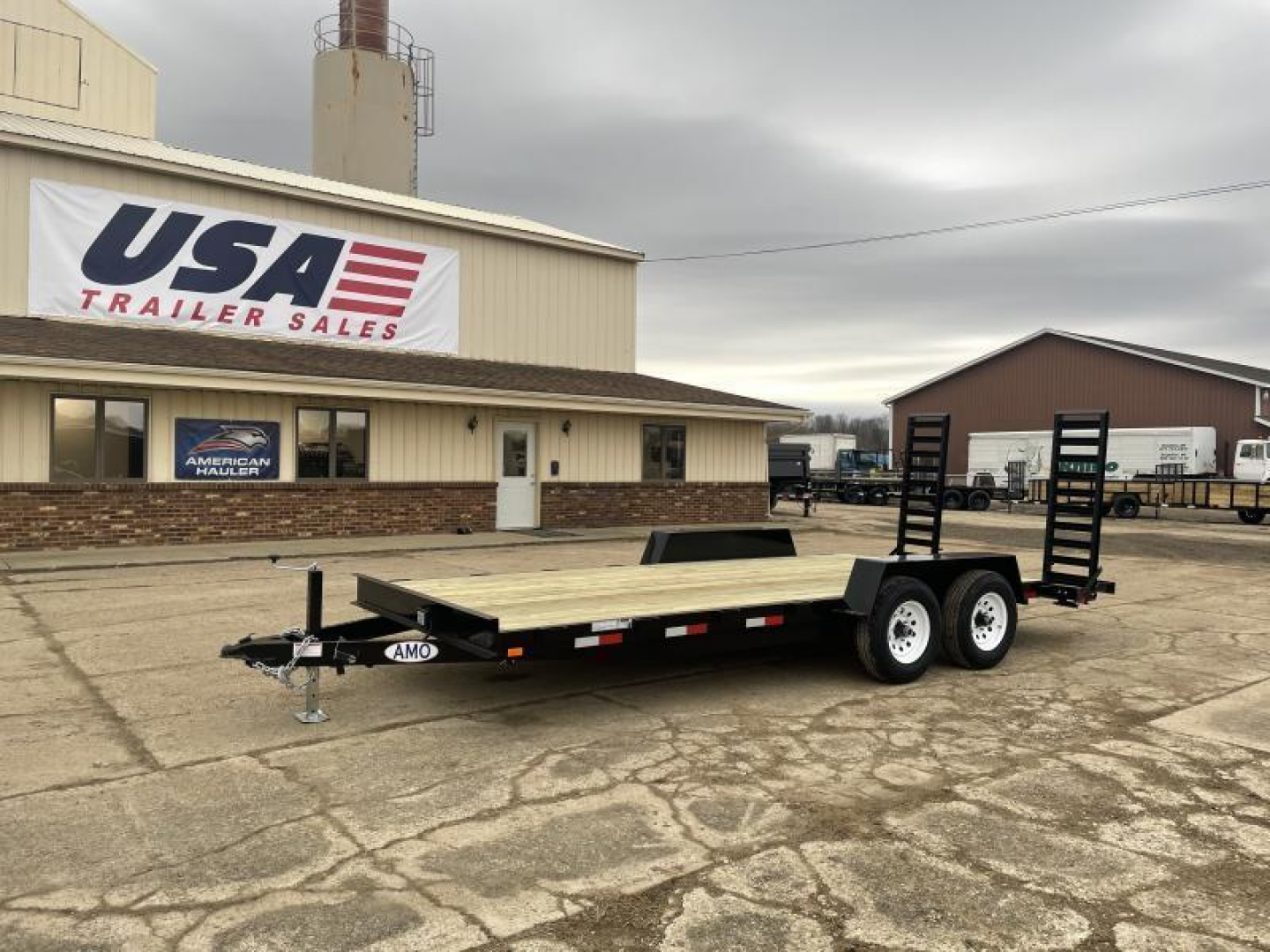 New 2026 AMO 82x18 Skidsteer 10k Equipment Trailer for sale in Wayland, MI
