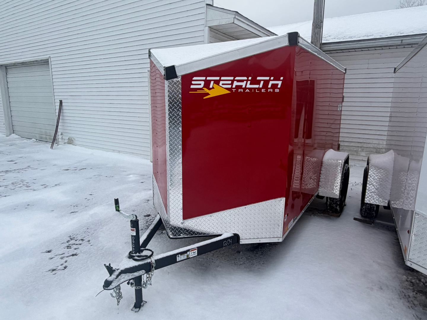 New 2026 5 x 10 Enclosed Stealth Trailer with Ramp for sale in Monroe, MI